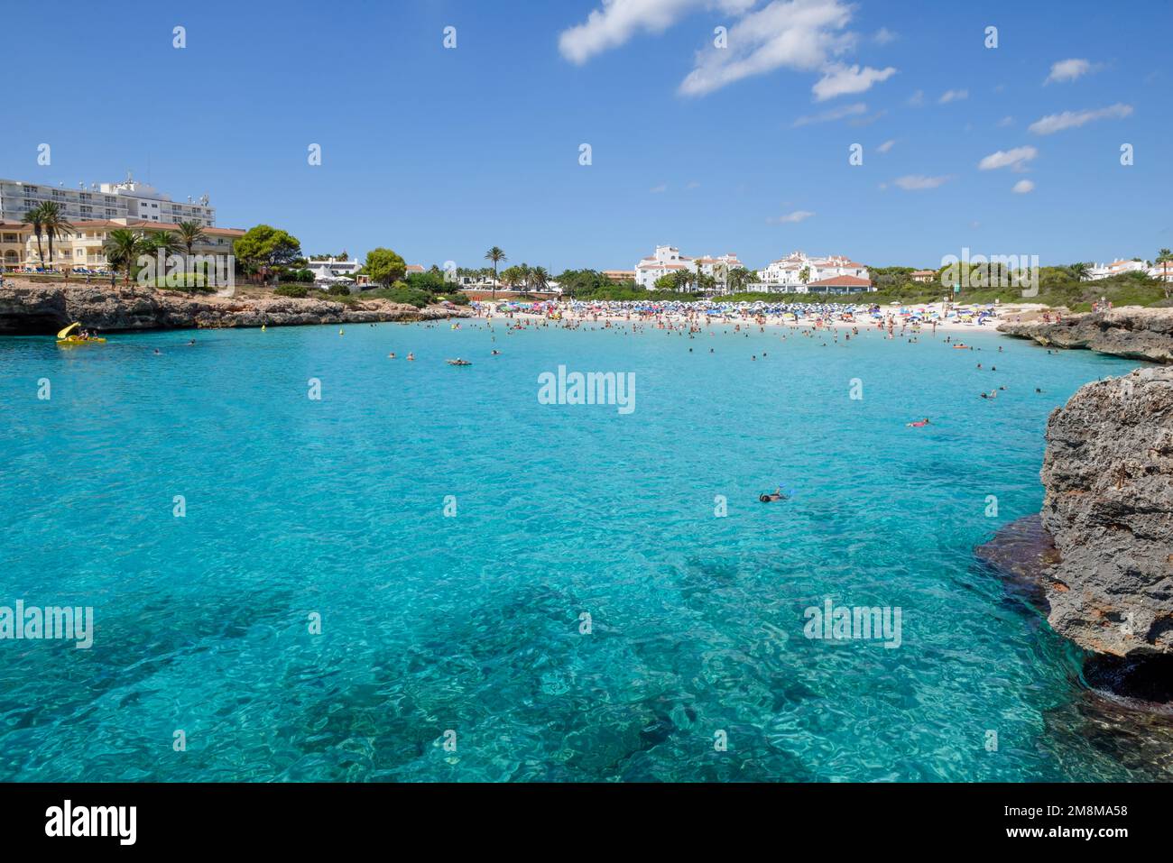Popular tourist beach resort at high angle with clear water and sandy ...