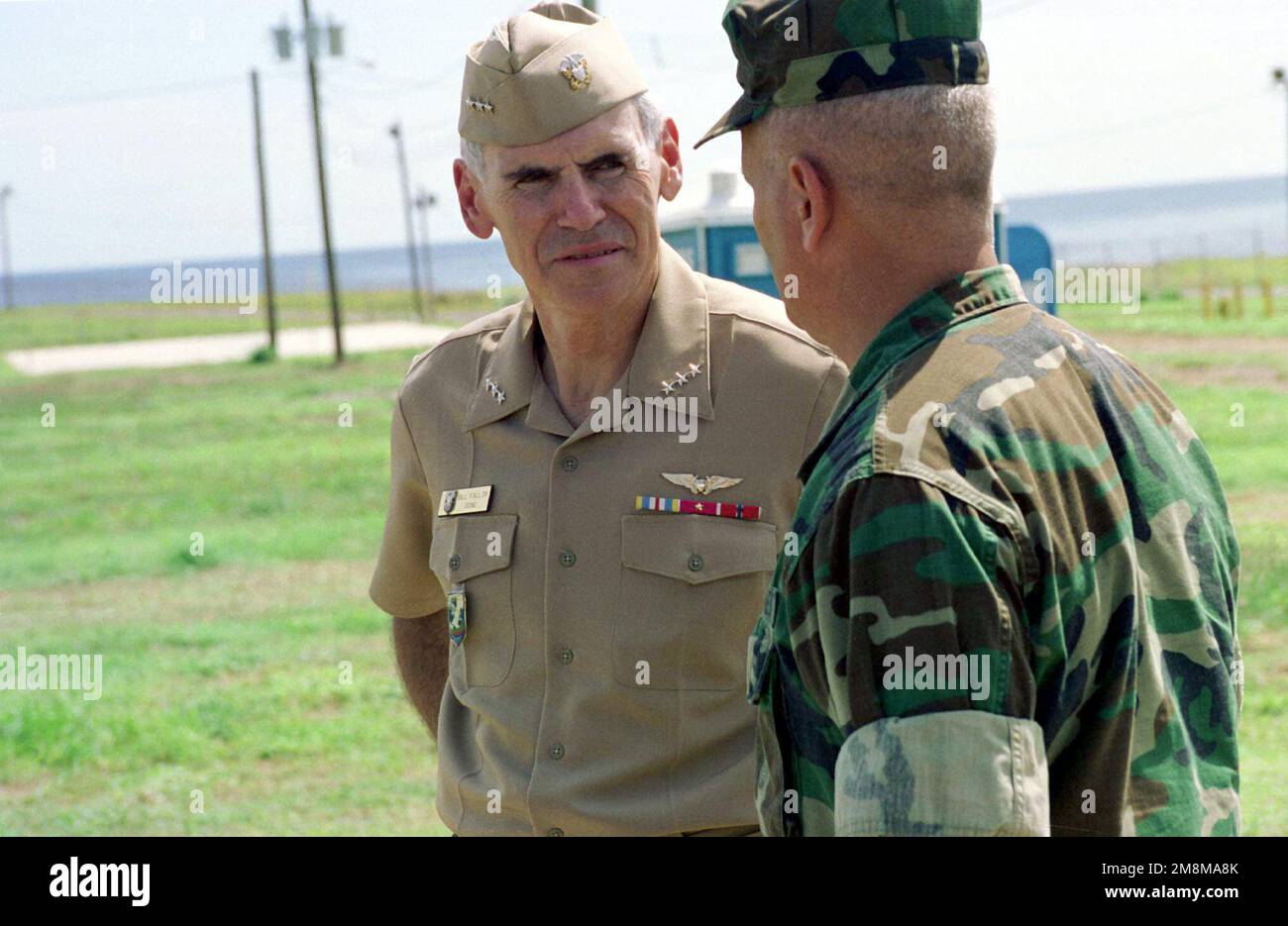 US Navy Vice Admiral William J. Fallon speaks with LT. COL. Lefebvre ...