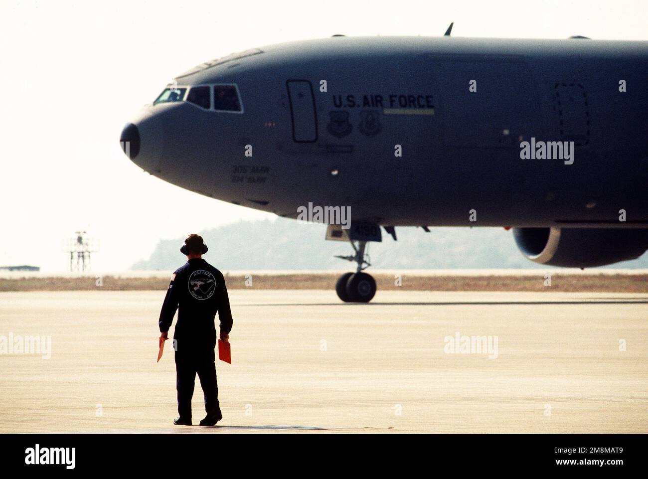 A close-up view of the front half of a KC-10 tanker. It is bringing ...