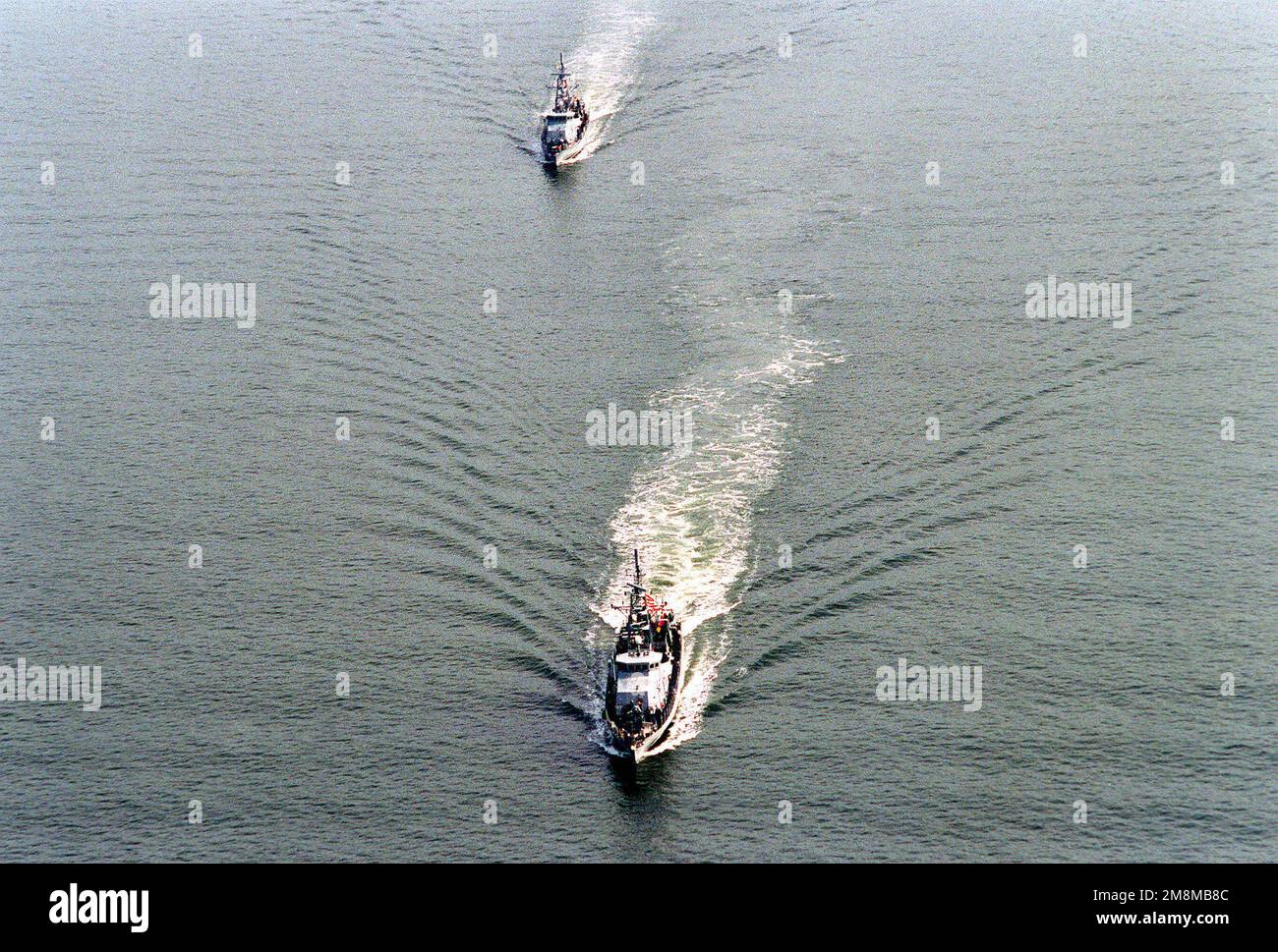 Aerial bow-on view of the coastal patrol craft USS FIREBOLT (PC-10) and ...