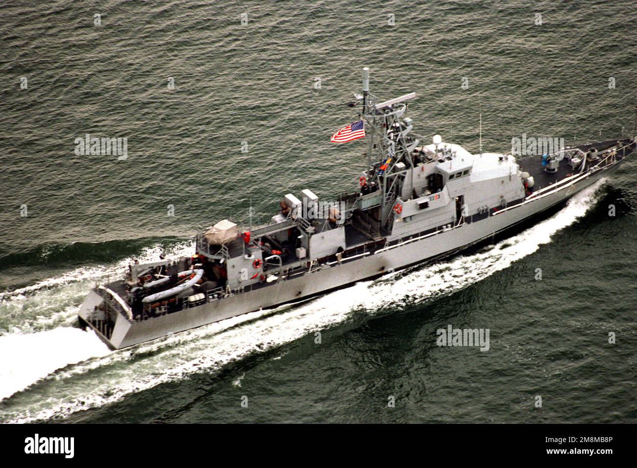 Aerial port side view of the coastal patrol craft USS CHINOOK (PC-9 ...
