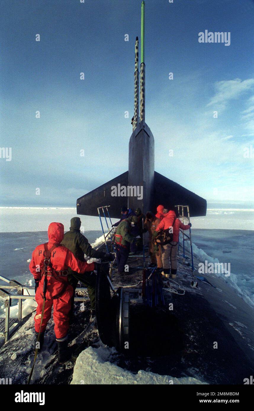 Crew members from the U.S. Navys attack submarine USS POGY (SSN 647 ...