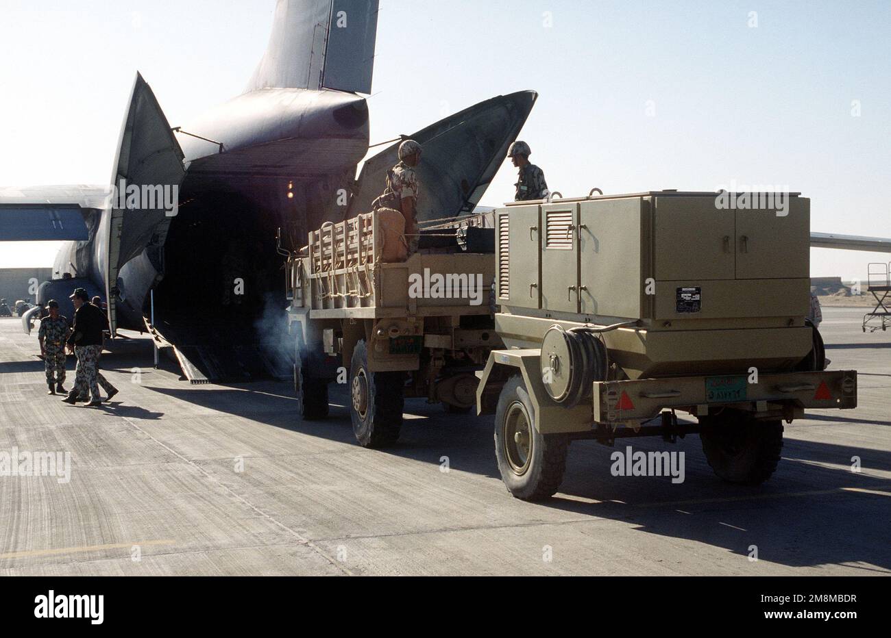 Egyptian soldiers load a truck and trailer onto a C-141B Starlifter ...