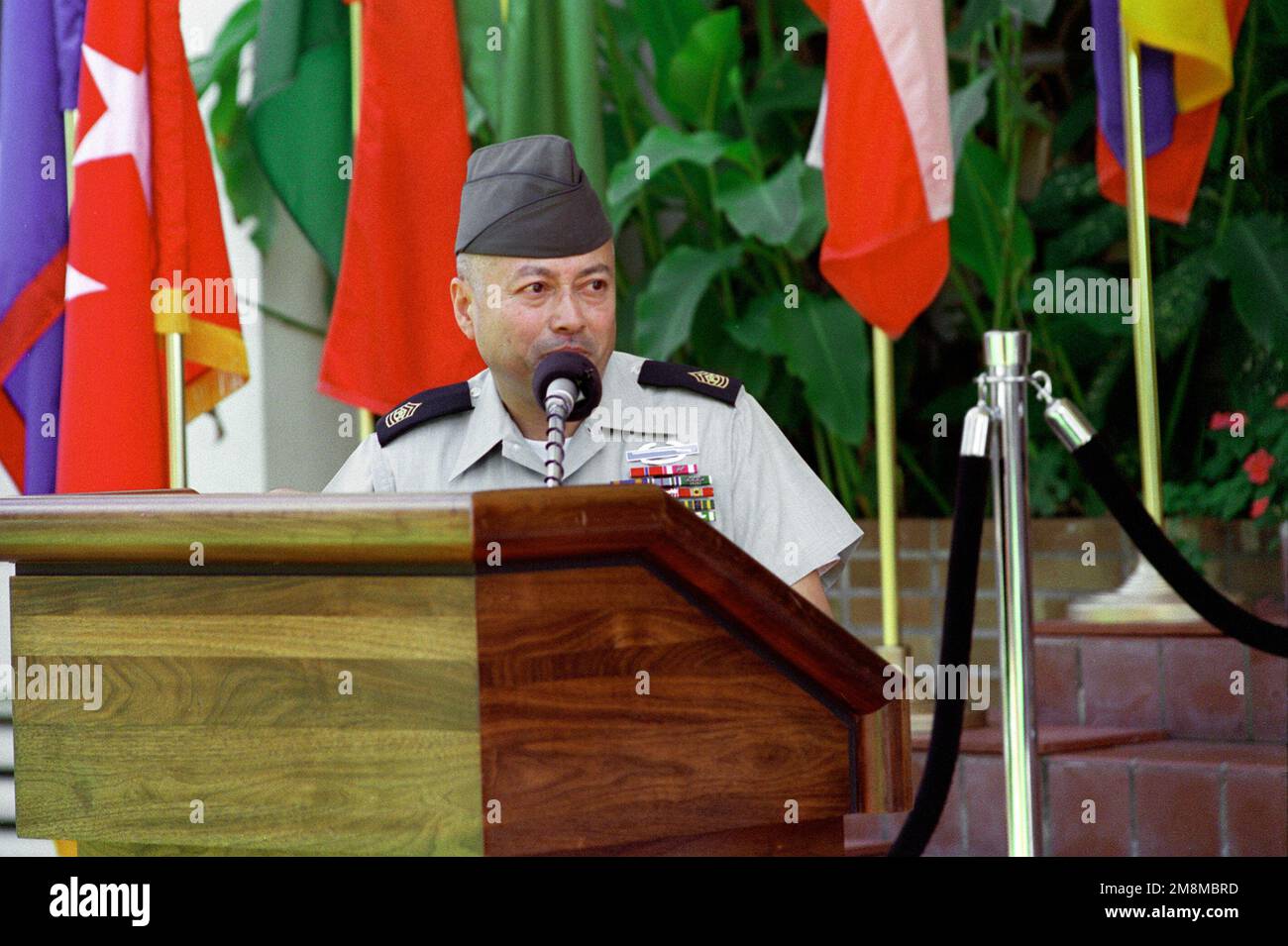 Command Sergeant Major Carlos Legoas, at the lectern gives his ...