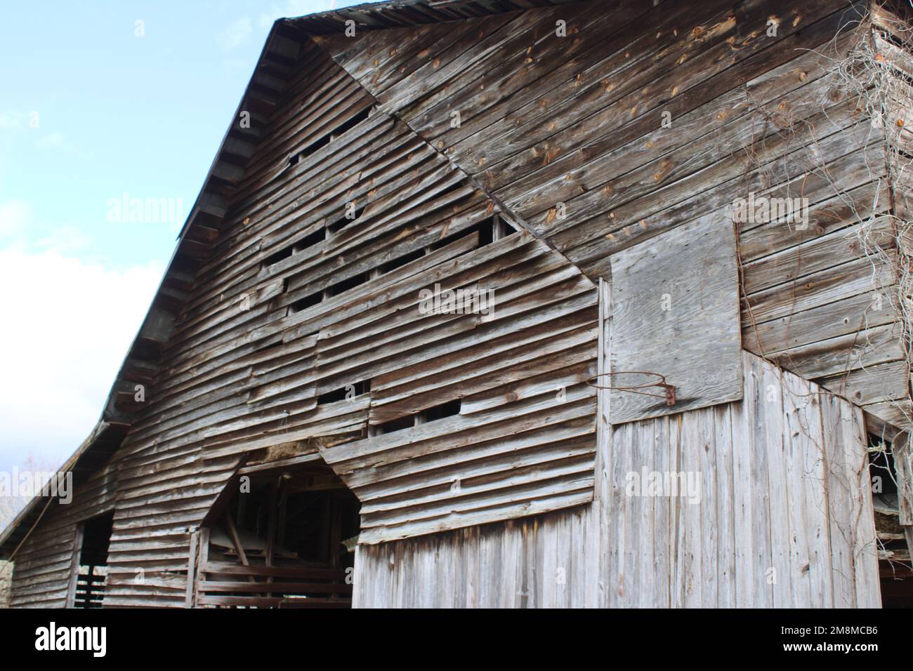 Weathered old barn wall with basketball hoop Stock Photo - Alamy