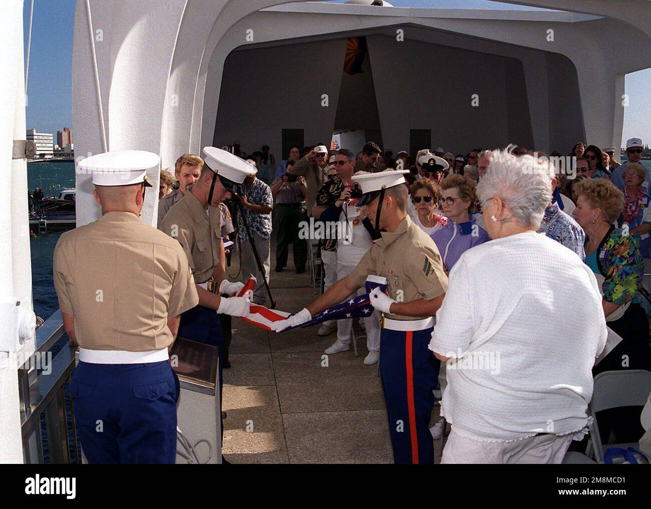US Marines fold an American Flag during the Burial at Sea Ceremony for ...
