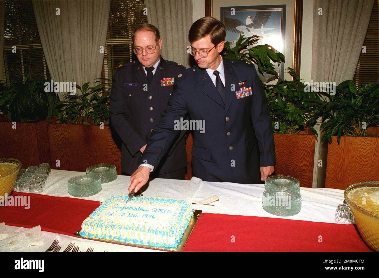 LT. COL. Ellsworth cuts the ceremonial cake making the integration of ...