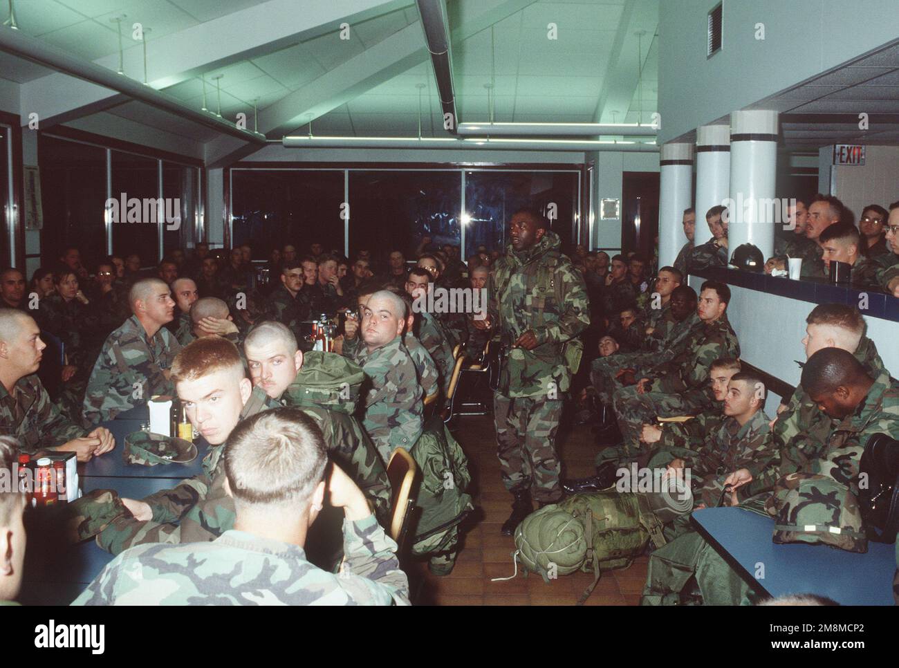 Marine GUNNERY Sergeant Eddie Fortson (standing) briefs Naval Mobile ...