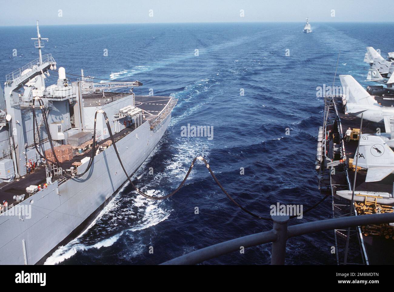 The combat support ship USS Detroit (AOE-4) steams alongside the ...