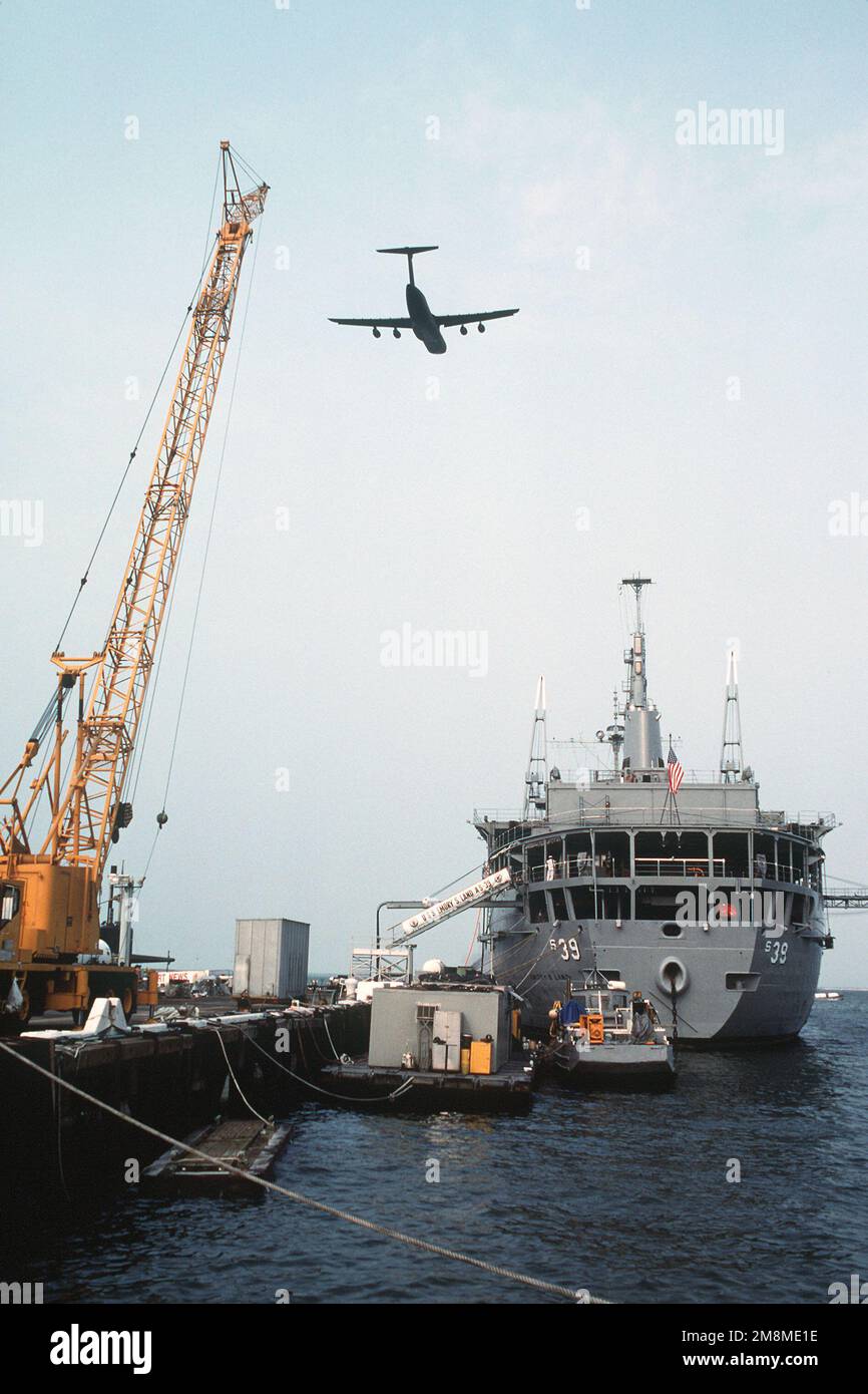 A stern view of the submarine tender USS Emory S. Land (AS-39) moored ...