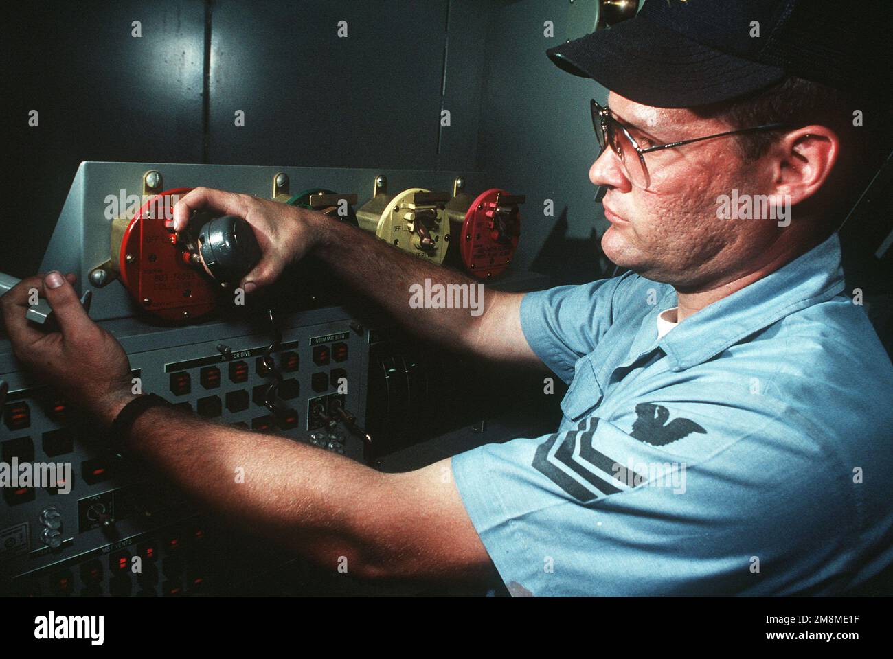 A sailor operates the controls that create the simulated leak series in ...