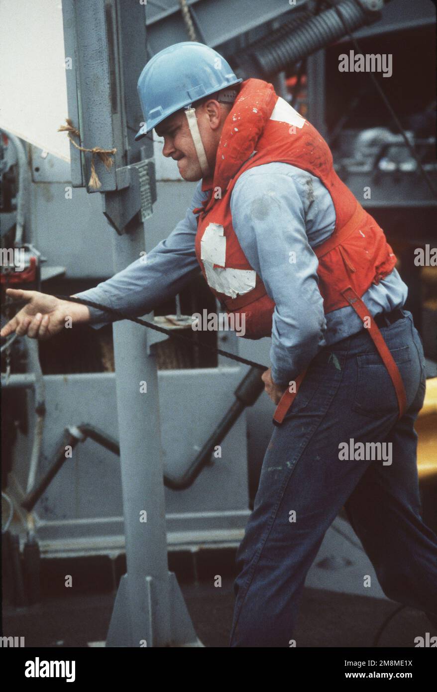 Mar 1992...A crewmember of the deck force of the replenishment oiler ...
