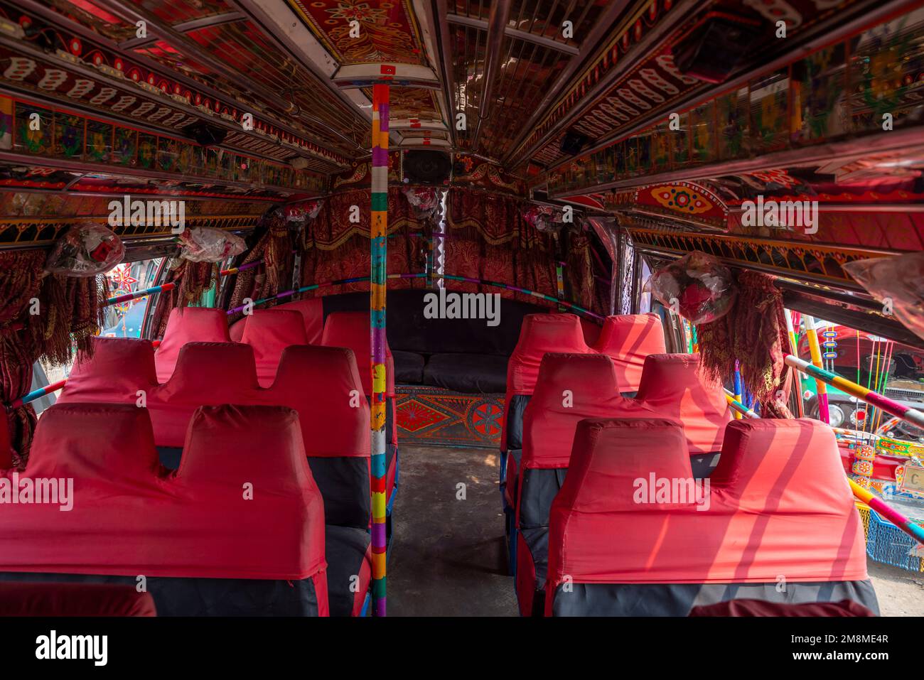 Seats and interiors of a colorfully painted bus, Peshawar, Pakistan ...