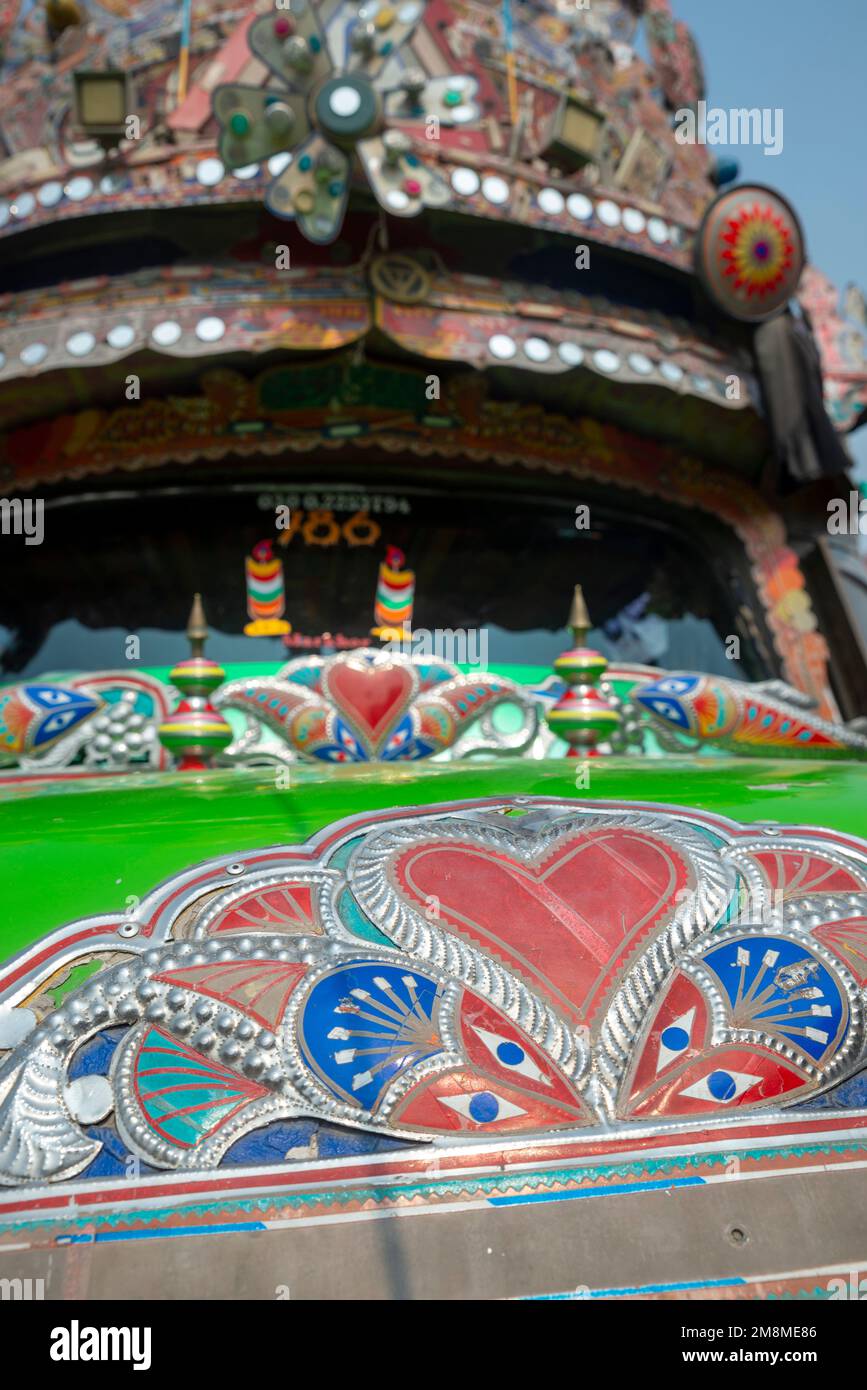 Detail of front decorations of a colorfully painted bus, Peshawar ...