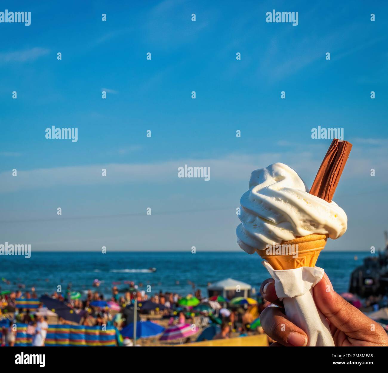Ice Cream cone on a sky blue background. Bournemouth beach in Dorset ...