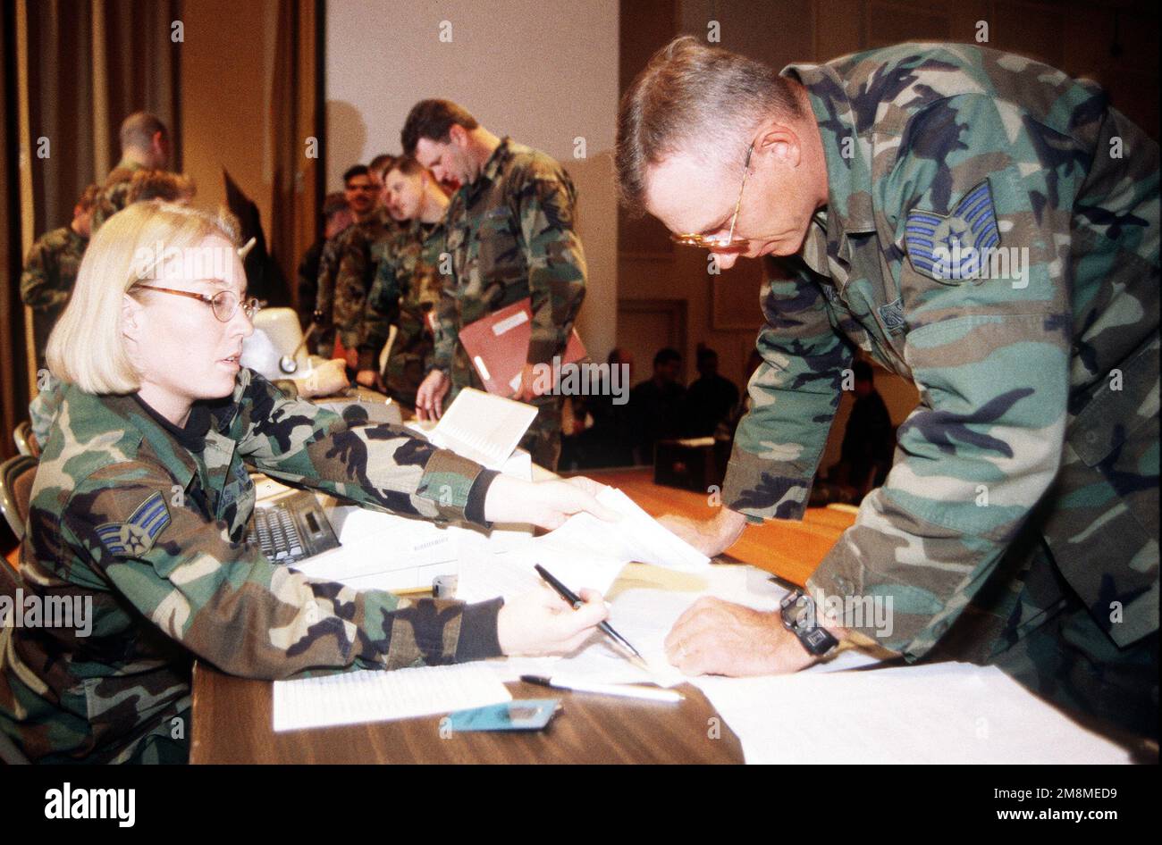 Members of the 99th Transportation Squadron are processed through the ...
