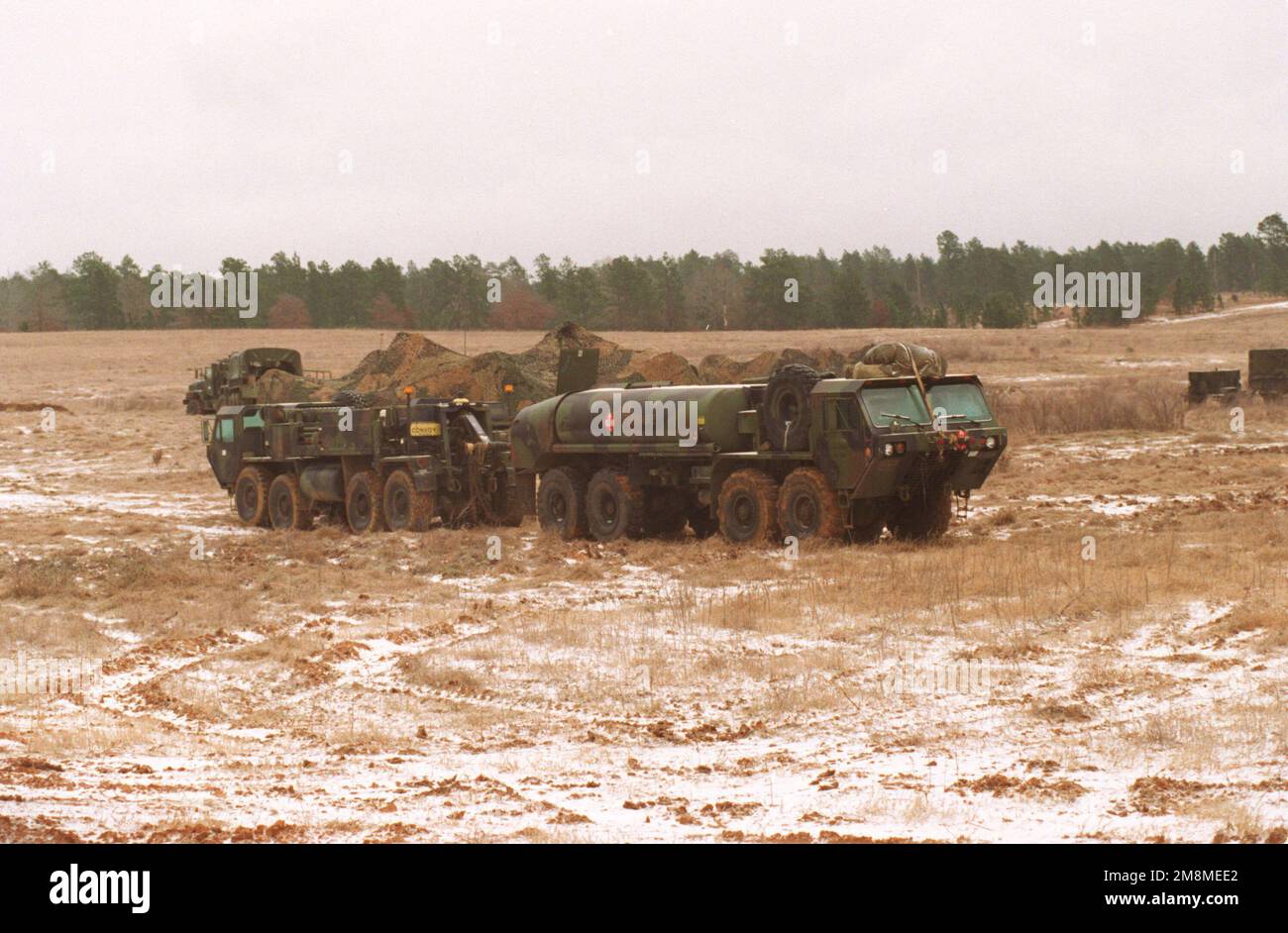 Oshkosh M978 Fuel Servicing Trucks stand ready as a field fueling ...