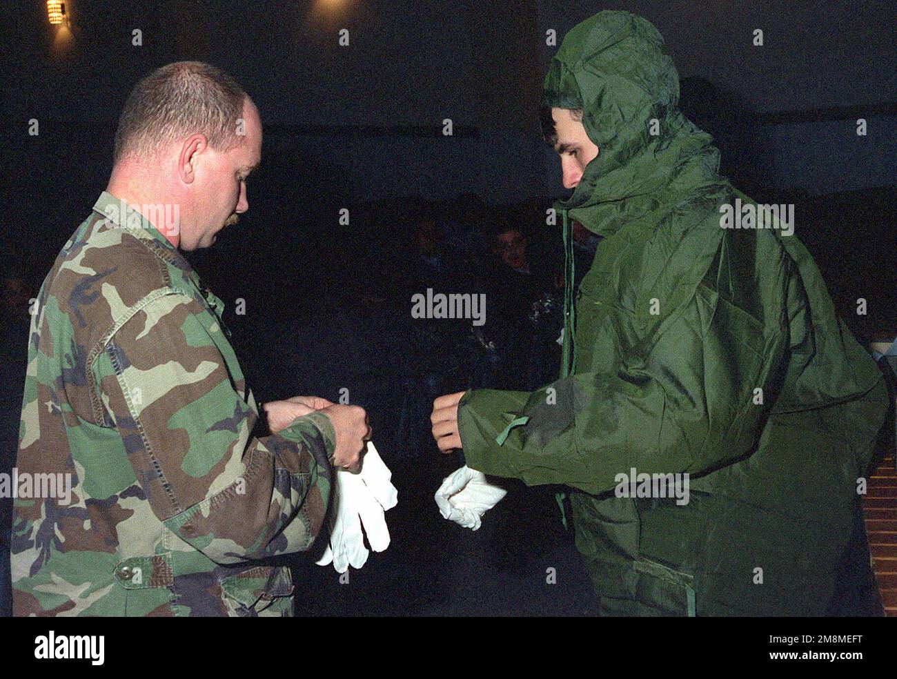 US Navy Damage Control Technician 1ST Class Jeffrey Reynolds assist ...