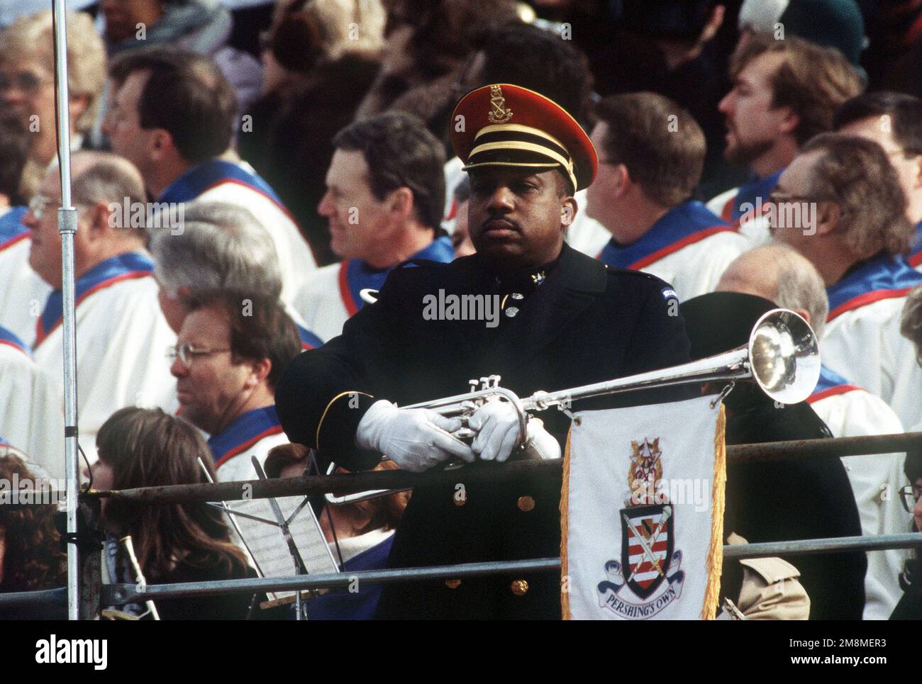 A member of the US Army Herald Trumpets watches the 1997 Presidential ...