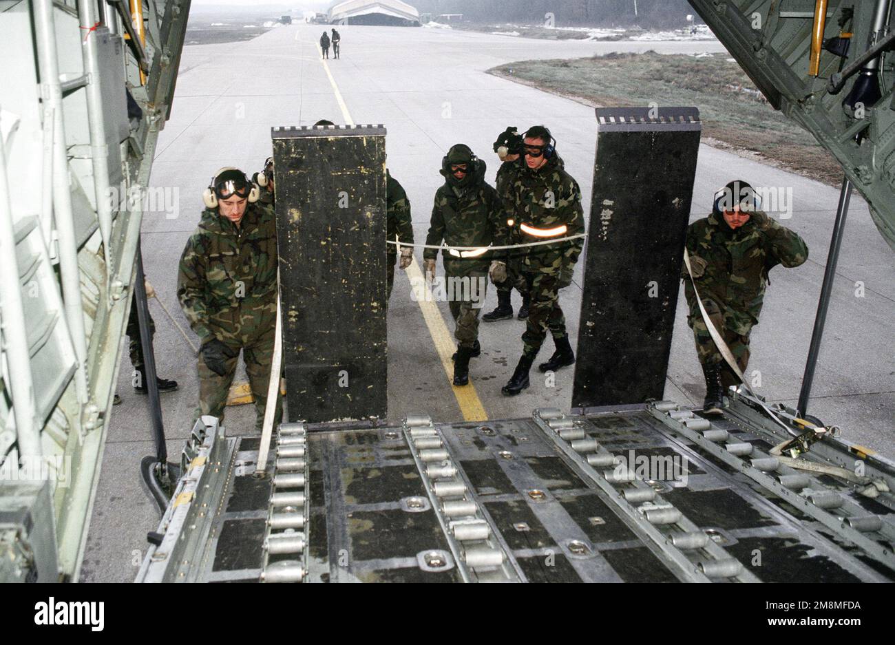 Member from "Team Tuzla" position themselves at the foot of the C-130 ...