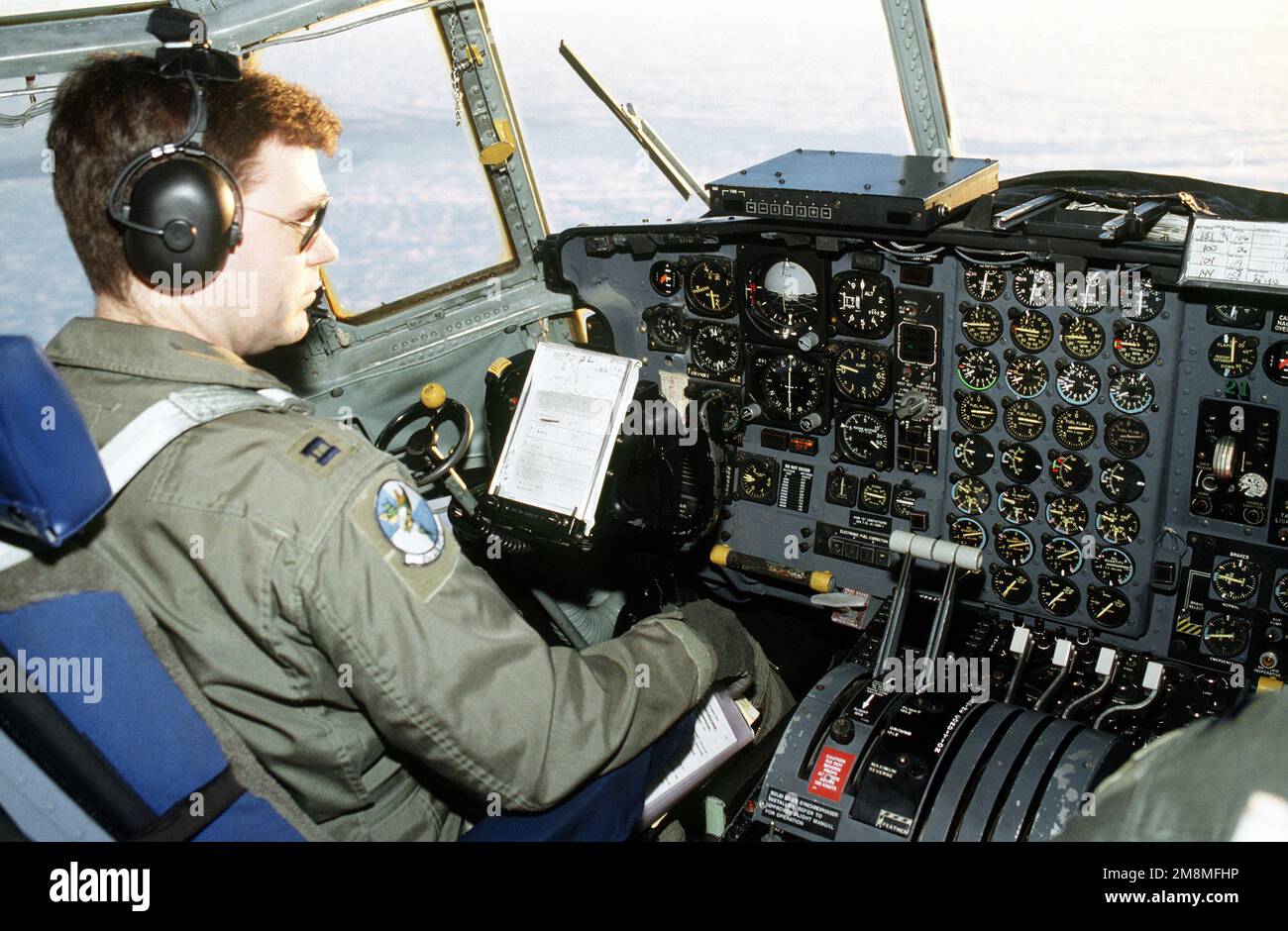 Enroute to Tuzla, Mission Commander CAPT. Tim Maguire pilots his C-130 ...