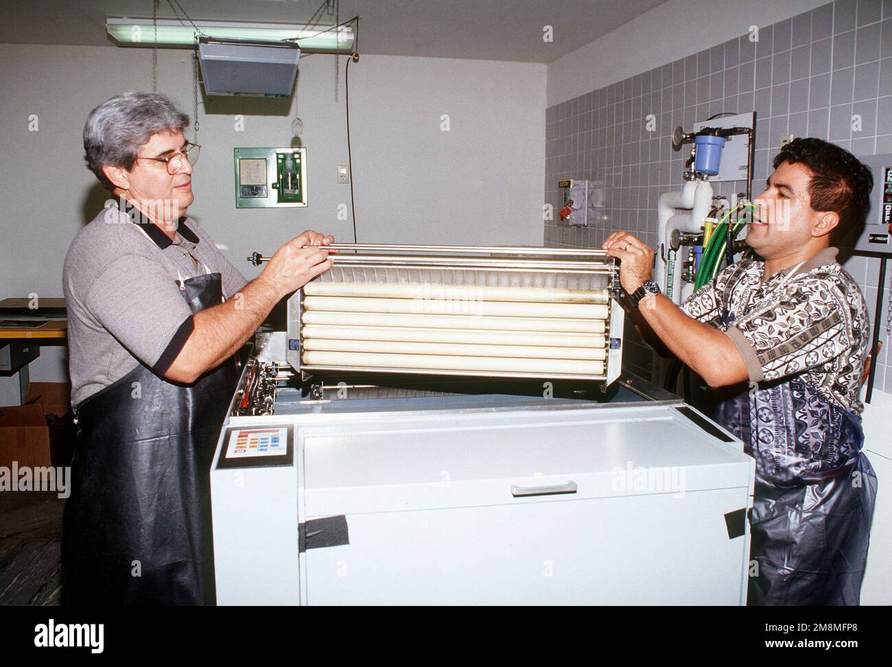 PHOTO Lab civilian photographers, O. C. Sanchez (left) and Charlie ...