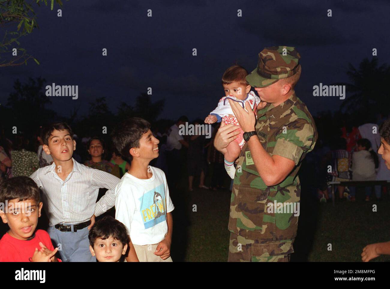 Lance CPL. David Bauman, 1ST Battalion, 6th Marines, hold a Kurdish new ...