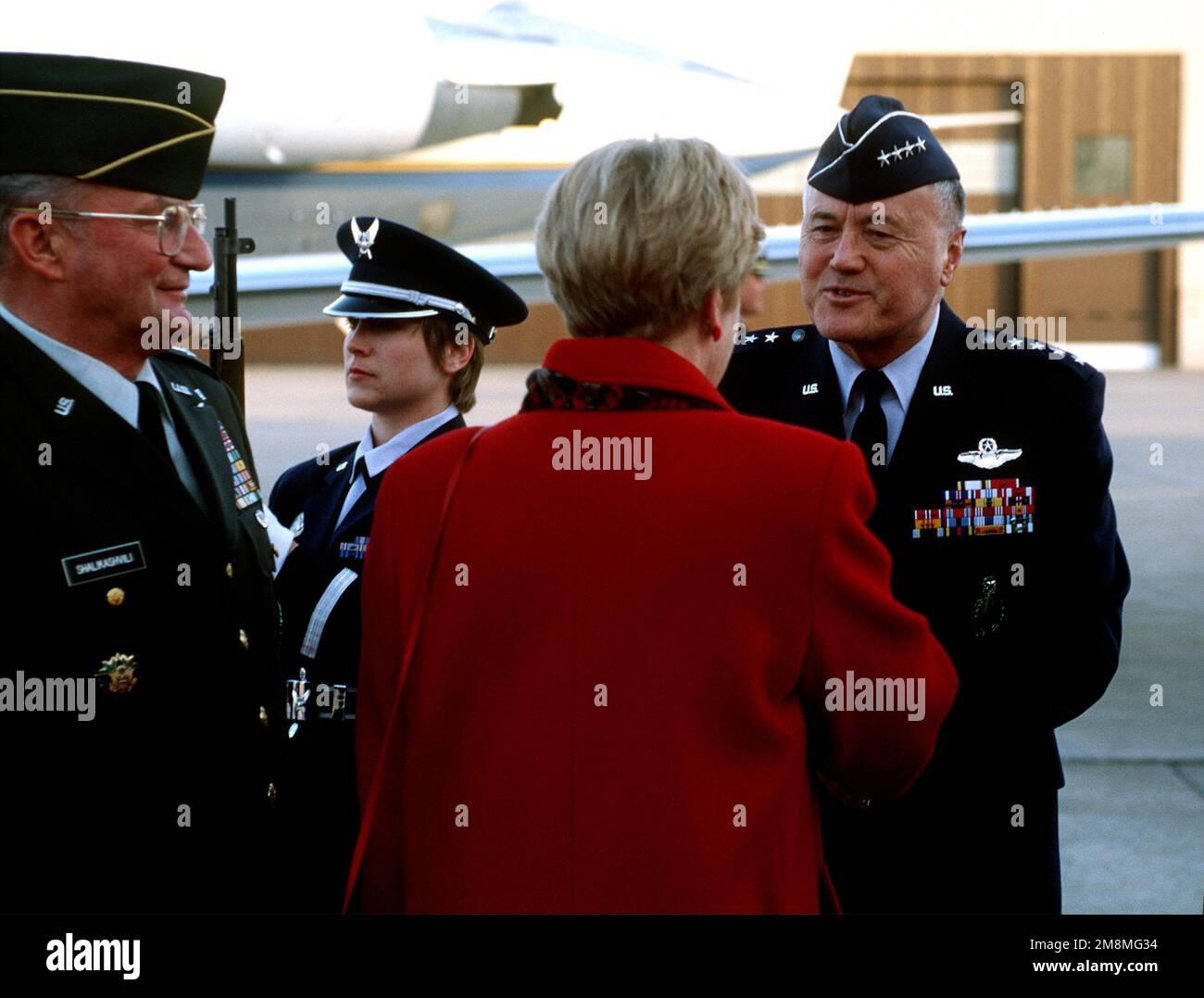 General John M. Shalikashvili stands next to his wife, Joan, as she is ...