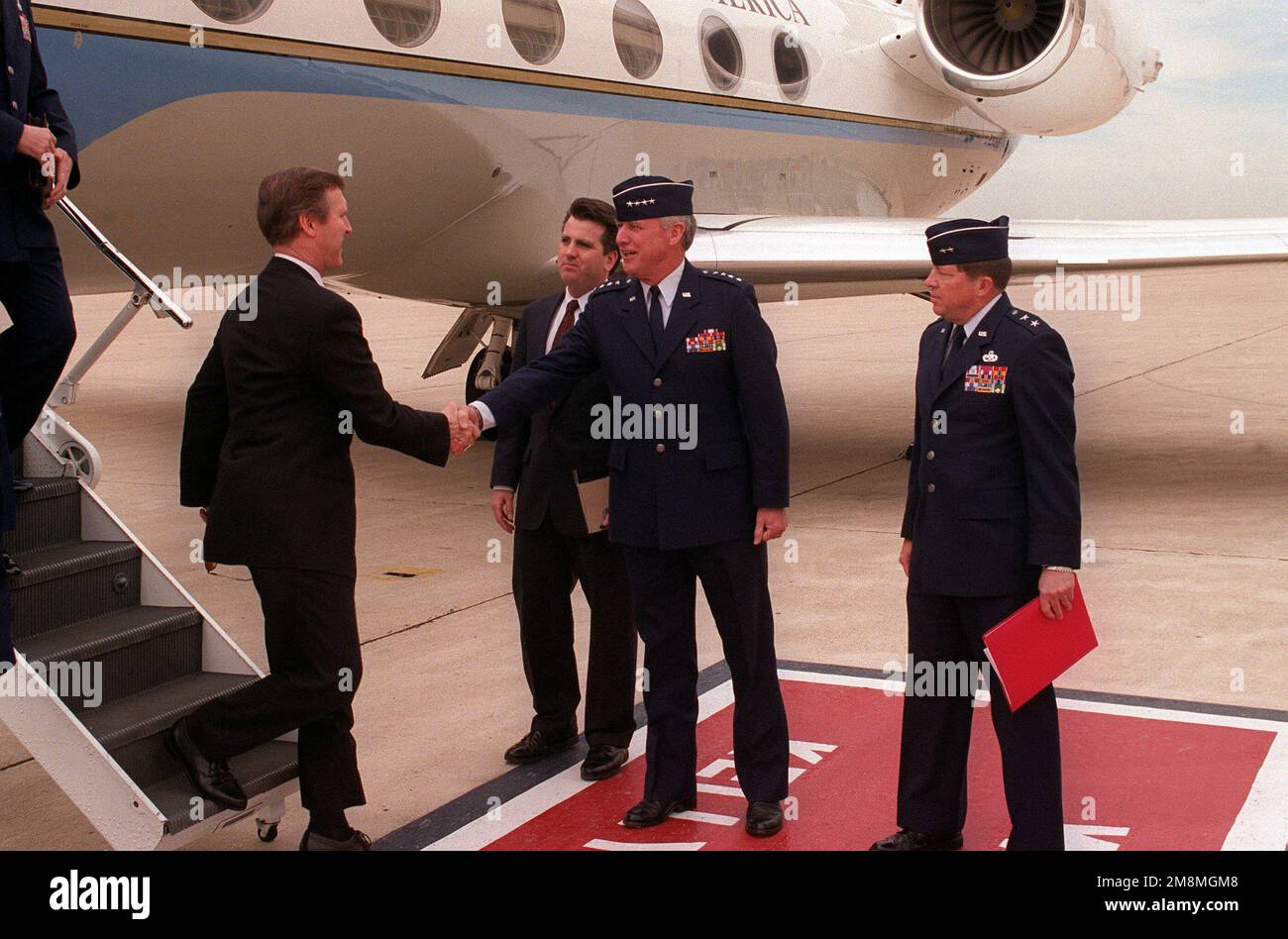 Secretary of Defense William Cohen is greeted by General Billy J. Boles ...
