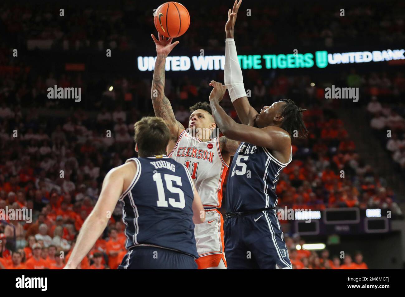 Clemson guard Brevin Galloway (11) scores over Duke forward Mark ...