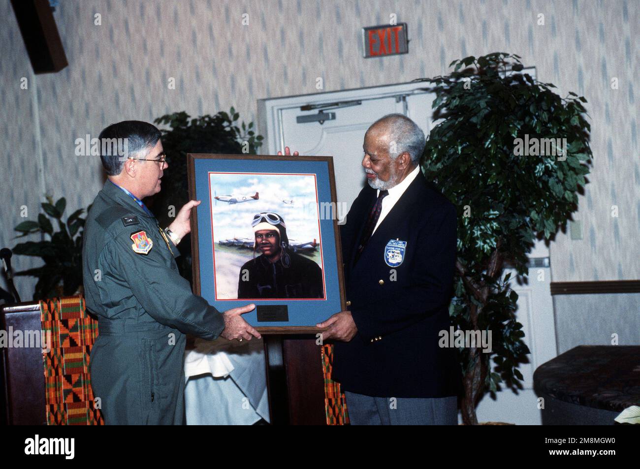 Major Lewis Lynch (retired) receives a portrait of himself as a ...
