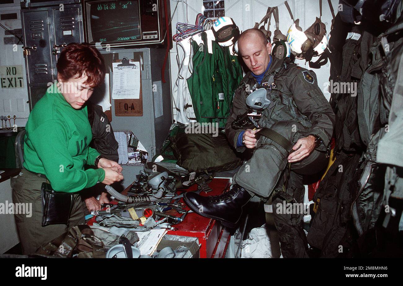 MAJ Steve "Lux" Luxion gets suited up for a Tomcat mission with the ...