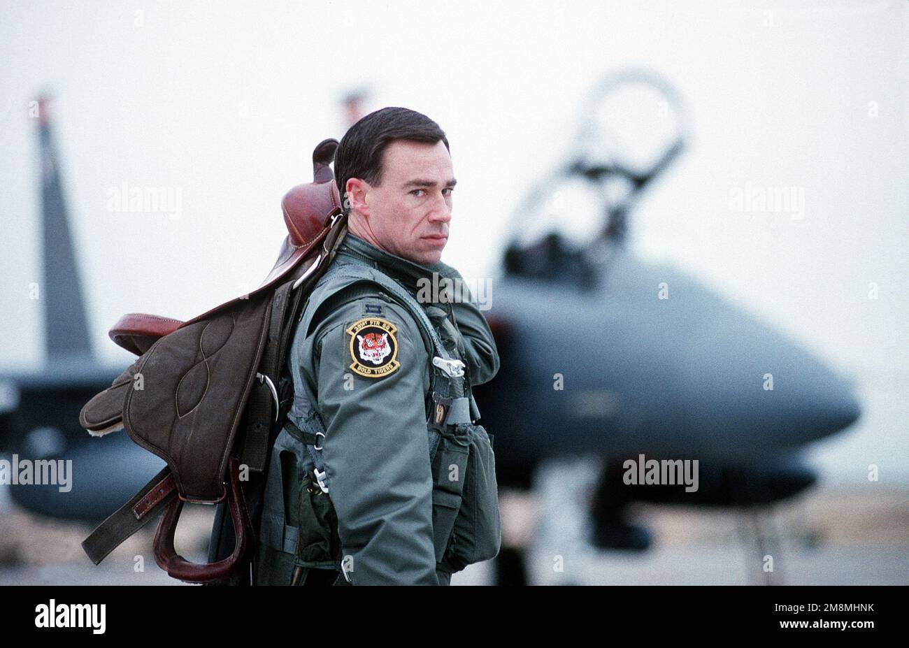 CPT Brian Udell, an F-15E pilot with the 366th Wing is shown carrying a ...