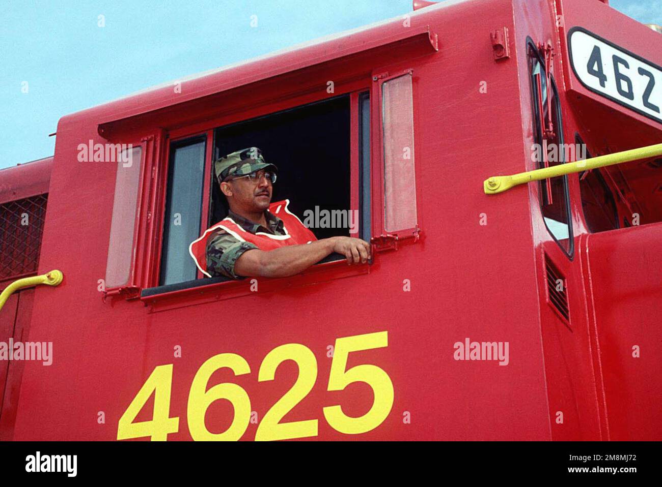 SPC Espada, locomotive engineer, guides a locomotive loaded with ...