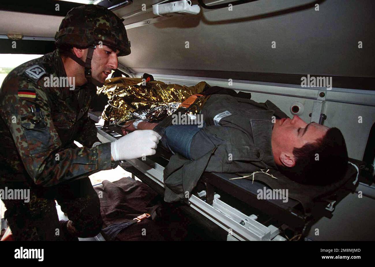 A medical technician from the German Air Force Rescue Center #1 secures ...