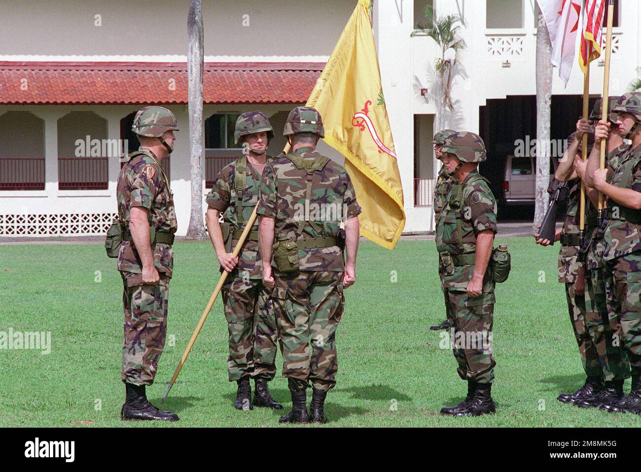 The new Commander, LT. COL. Timboe, takes the colors during the Change ...