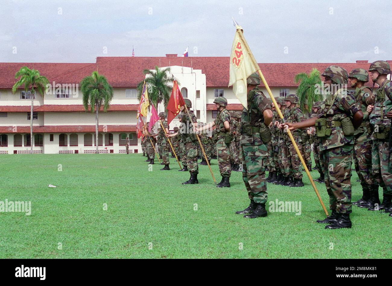 Soldiers of the 245th Support Battalion stand at parade rest during the ...