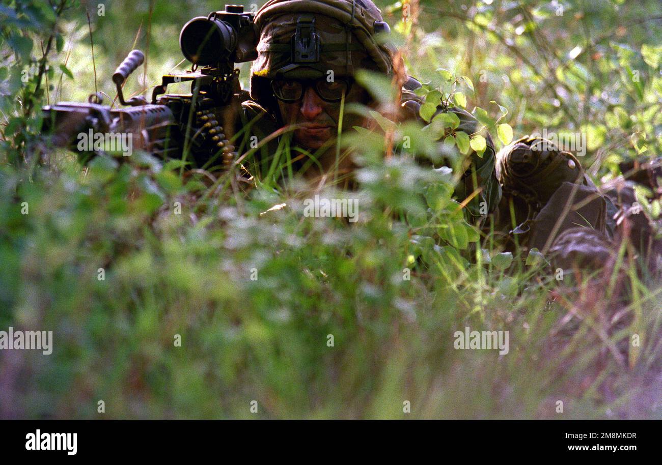 An Army Ranger keeps a sharp eye out for the enemy while conducting a ...