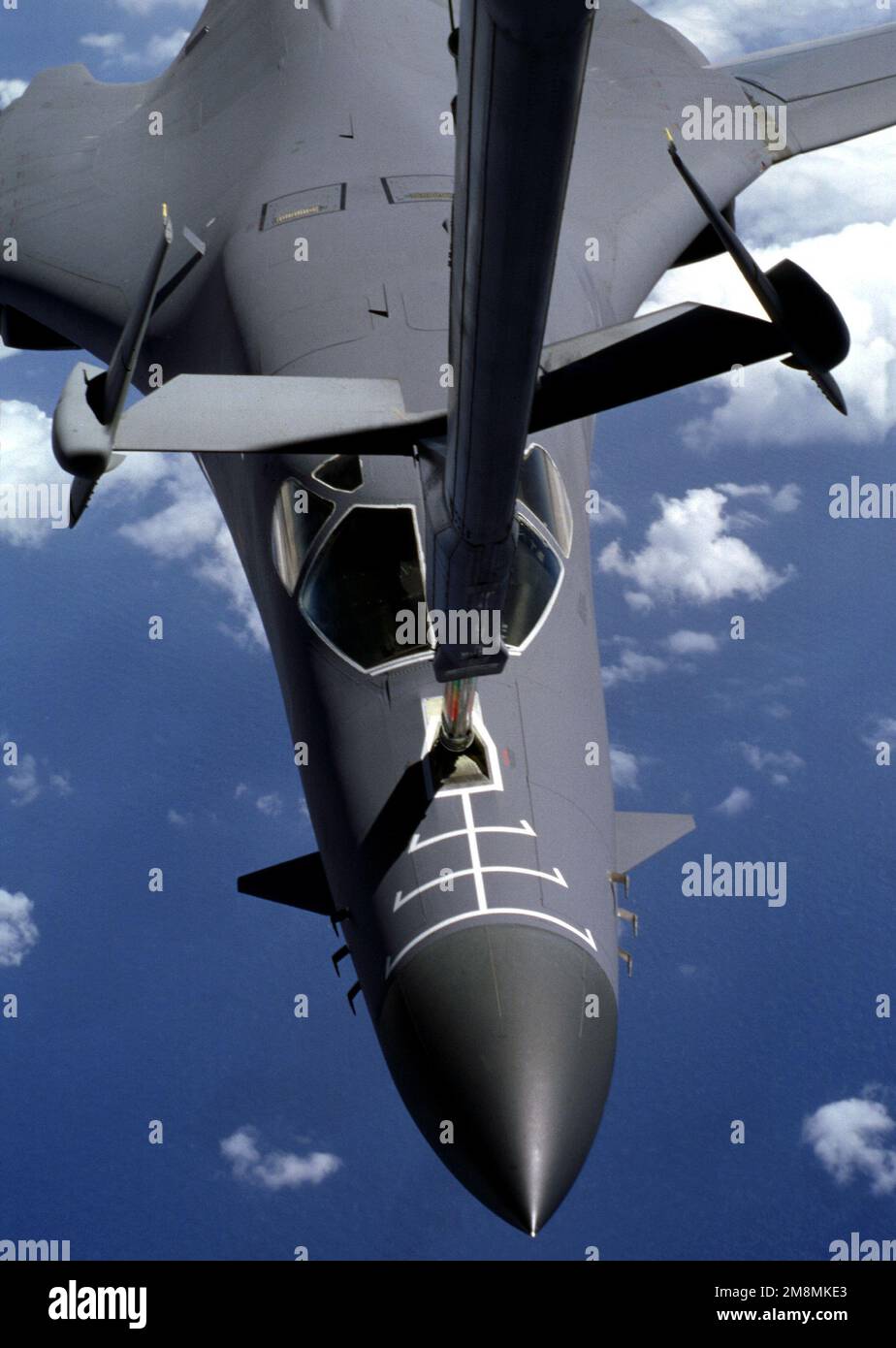 A USAF B-1 Lancer aircraft connects to the refueling probe of a KC-10 ...