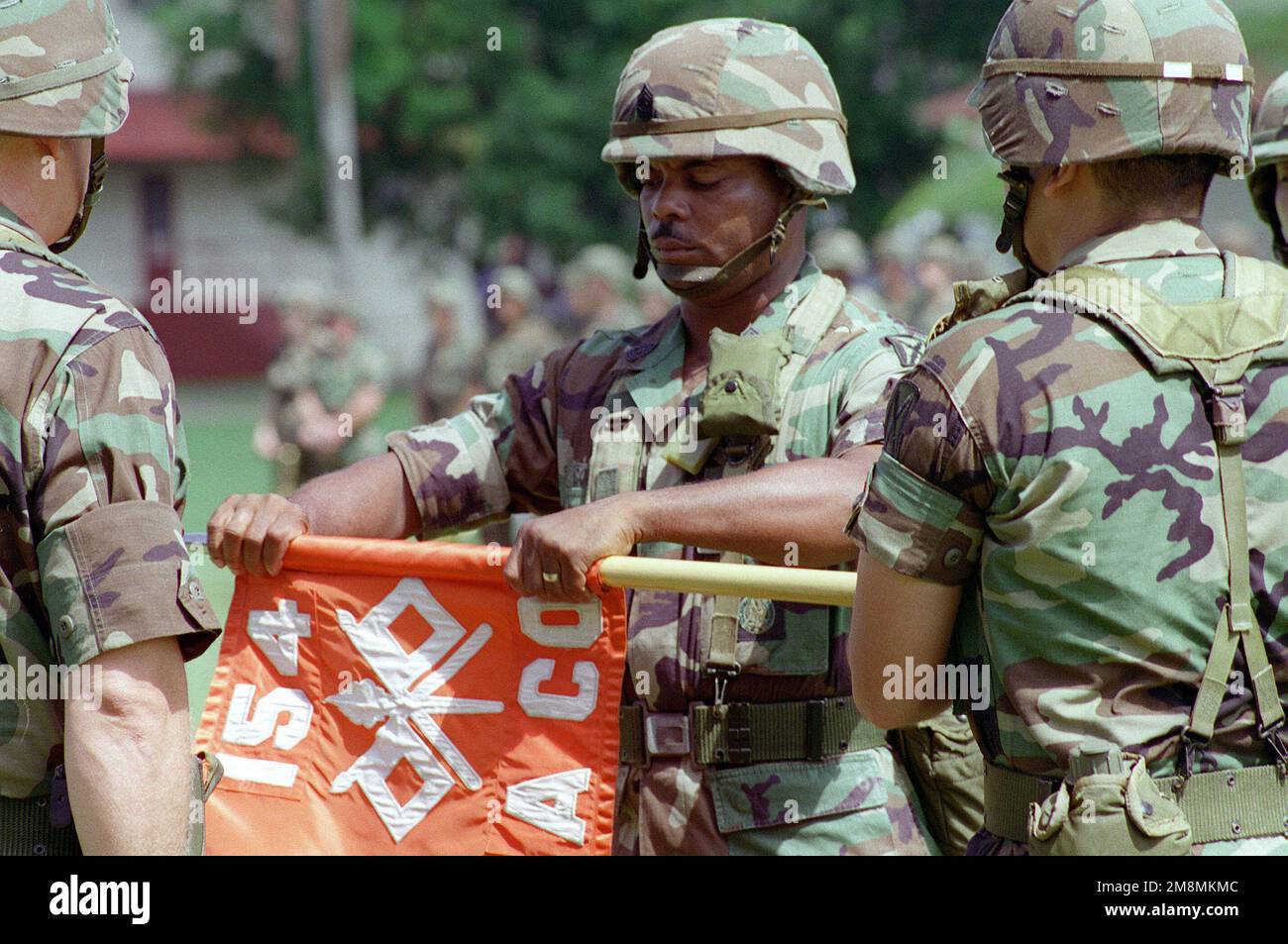 SFC Cupnai rolls up the flag during the Inactivation Ceremony of the ...