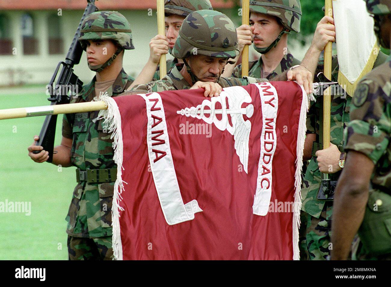 SGT. 1ST Class Berry rolls up the flag during the MEDDAC/DENTAC ...