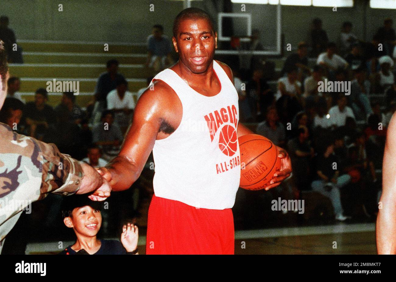 Magic Johnson takes time out of his busy schedule to visit with ...