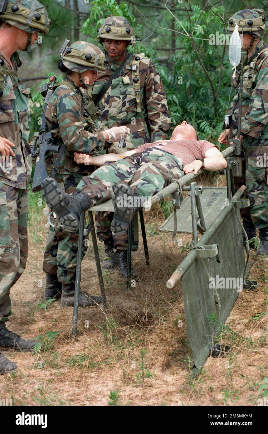 Medics from the 2nd Armored Cavalry Regiment administers first-aid to a casualty at the Joint ...