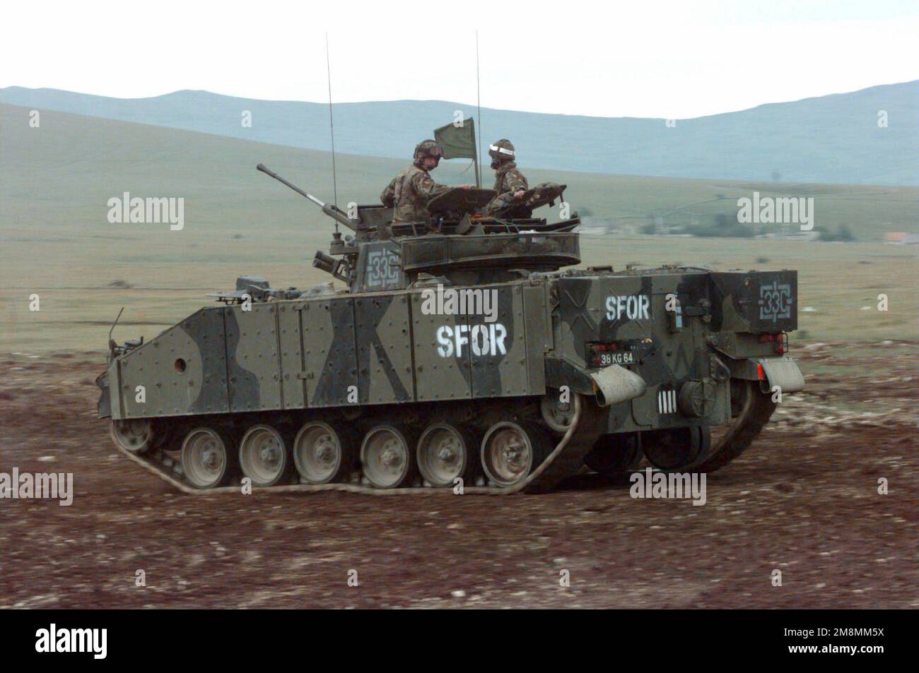 Stabilization Force (SFOR) British Warrior armored fighting vehicles move into position during ...