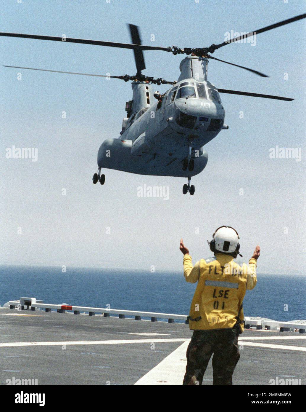 Eased in, a Marine CH-46E Sea Knight from HMM 164 (REIN) embarks aboard ...