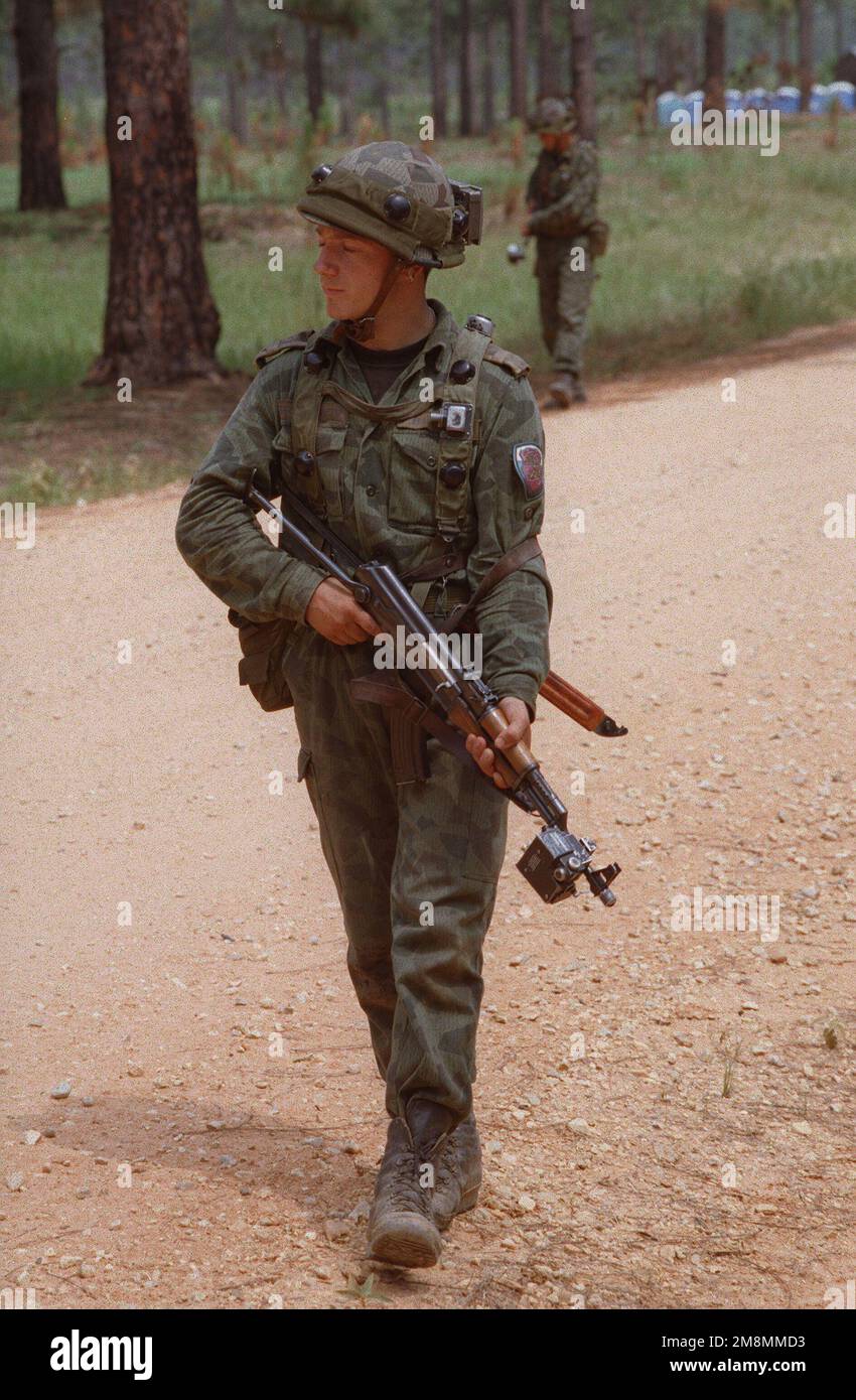 A Partnership For Peace soldier, armed with an AK-47 rifle that is ...