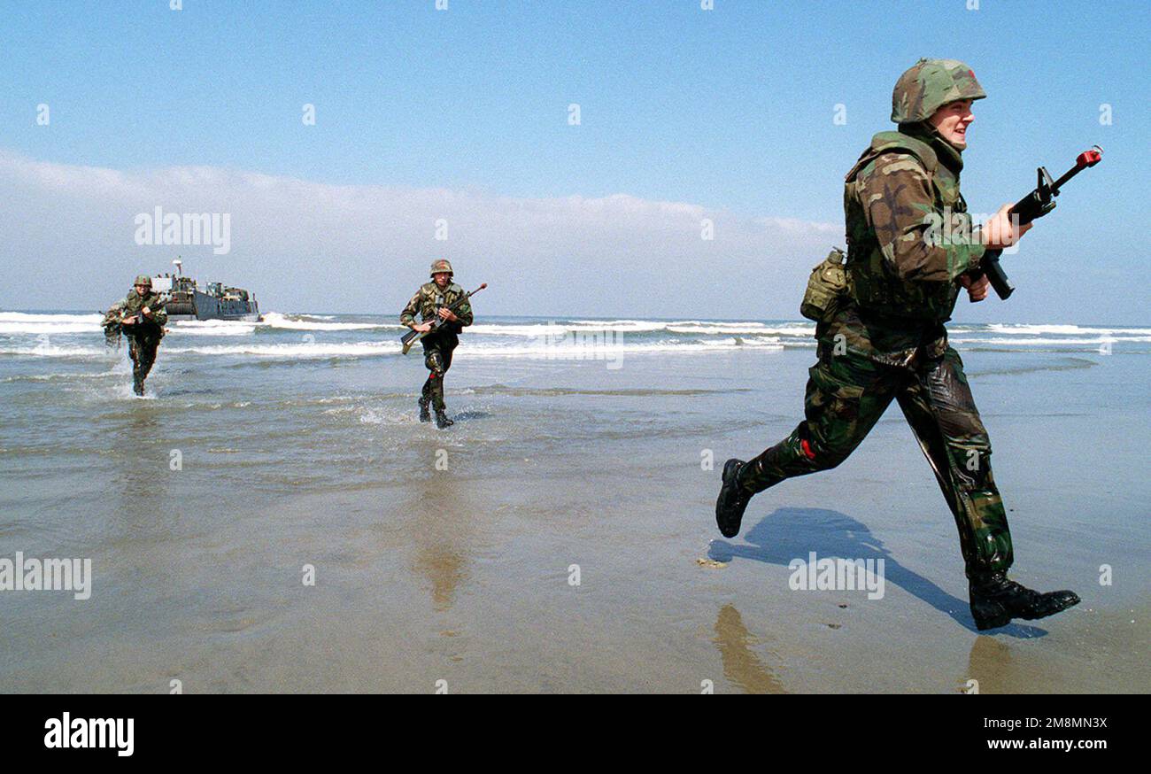 Coming off a Landing Craft, Utility (LCU), Marines from the 1ST Landing ...