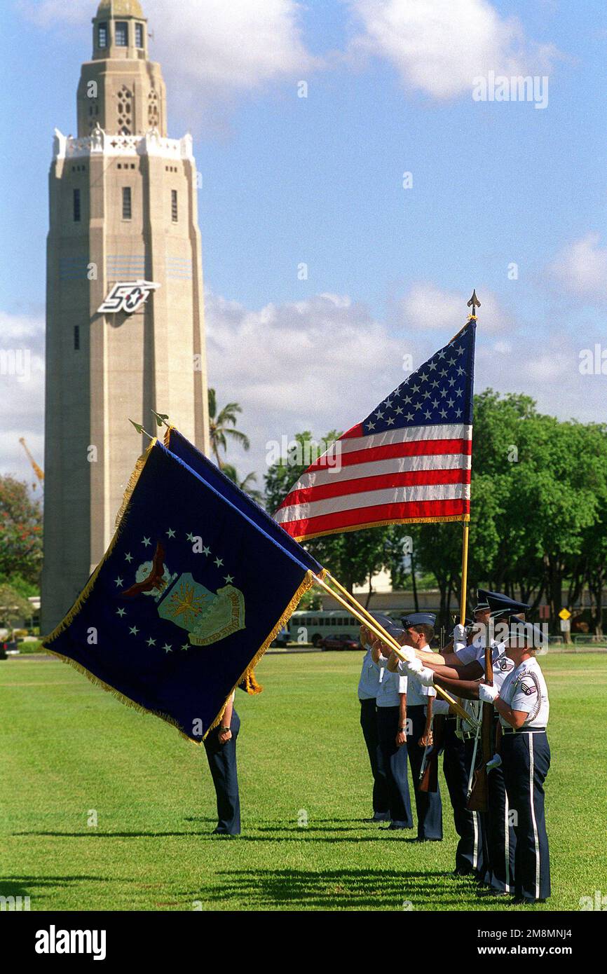 Members of the PACAF Honor Guard display the colors during the National ...