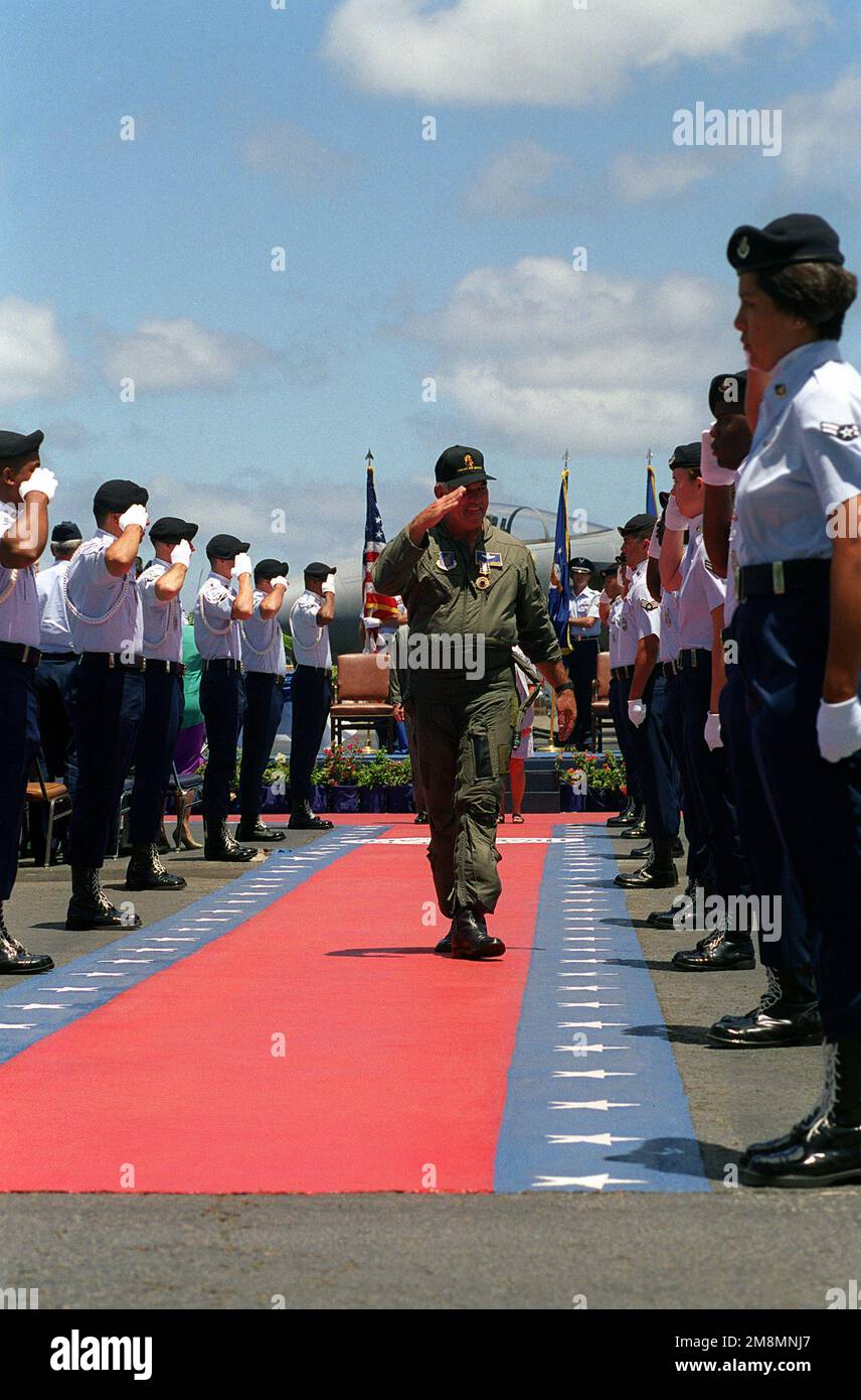 GEN John Lorber salutes his troops as he walks down the red carpet ...