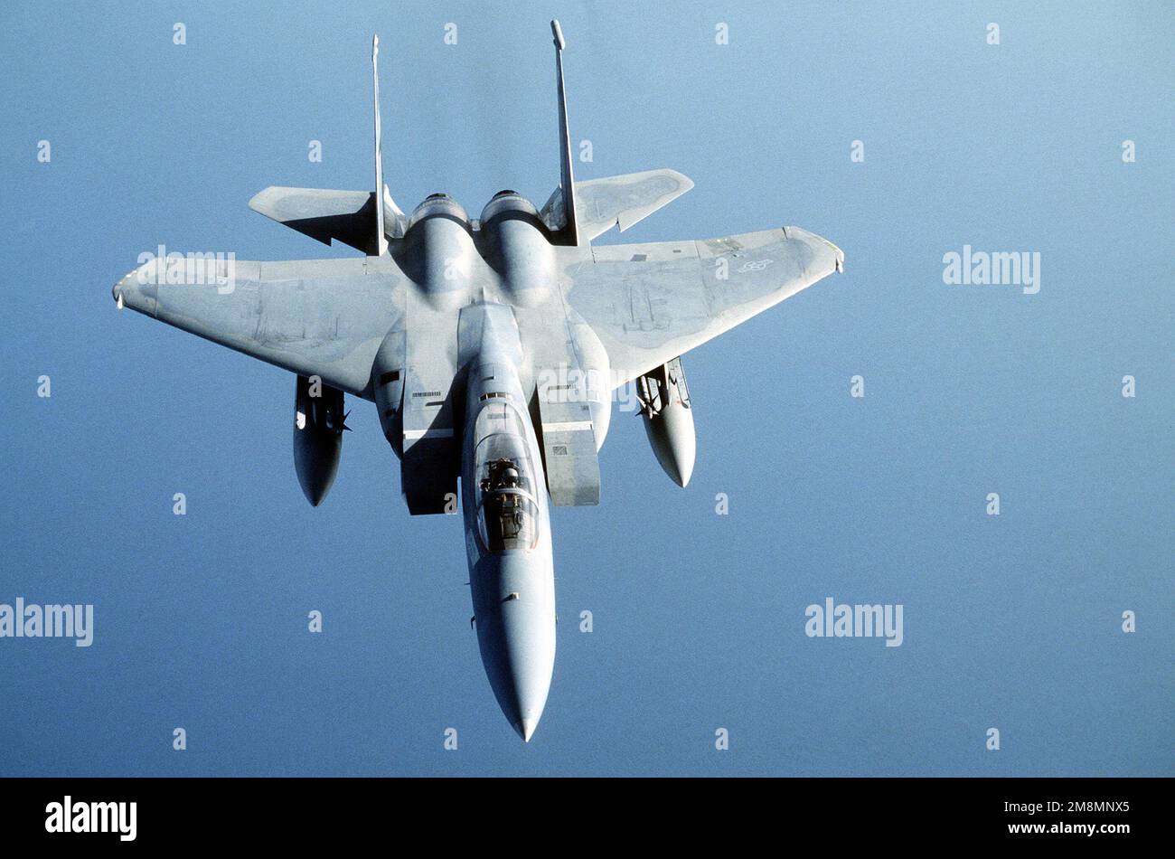 An overhead close-up view of an F-15 Strike Eagle as it moves in for ...